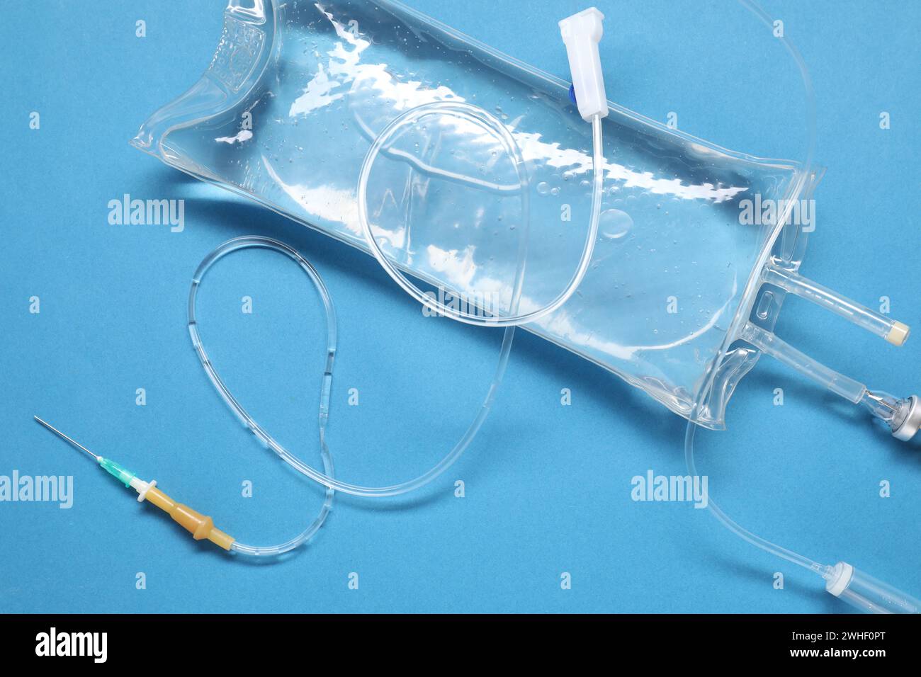 IV infusion set on light blue background, top view Stock Photo - Alamy