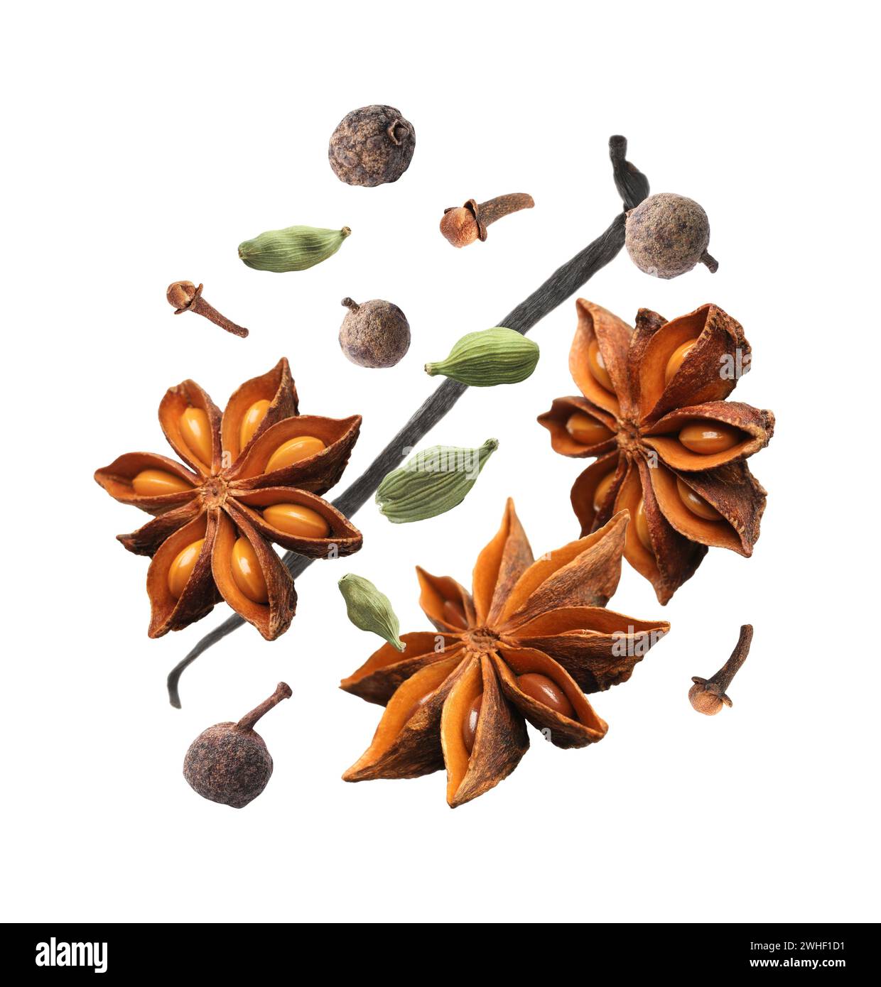 Different aromatic spices falling on white background Stock Photo - Alamy