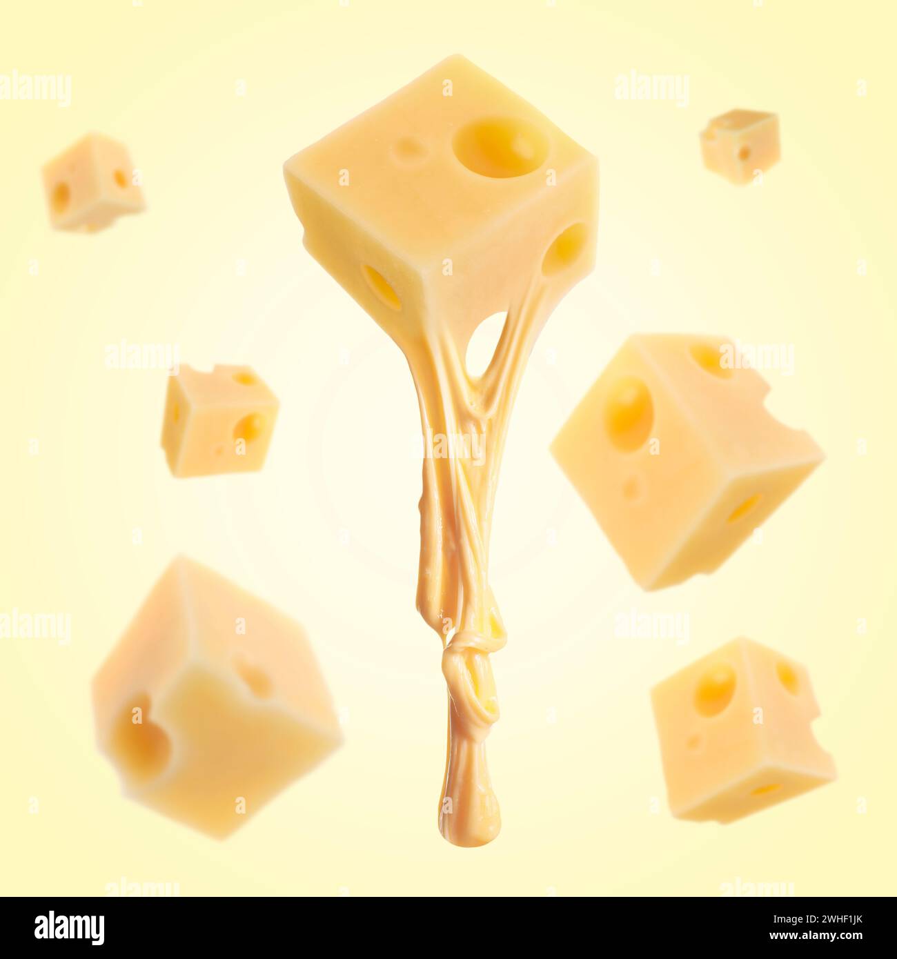 Pieces of cheese falling on yellow background Stock Photo - Alamy