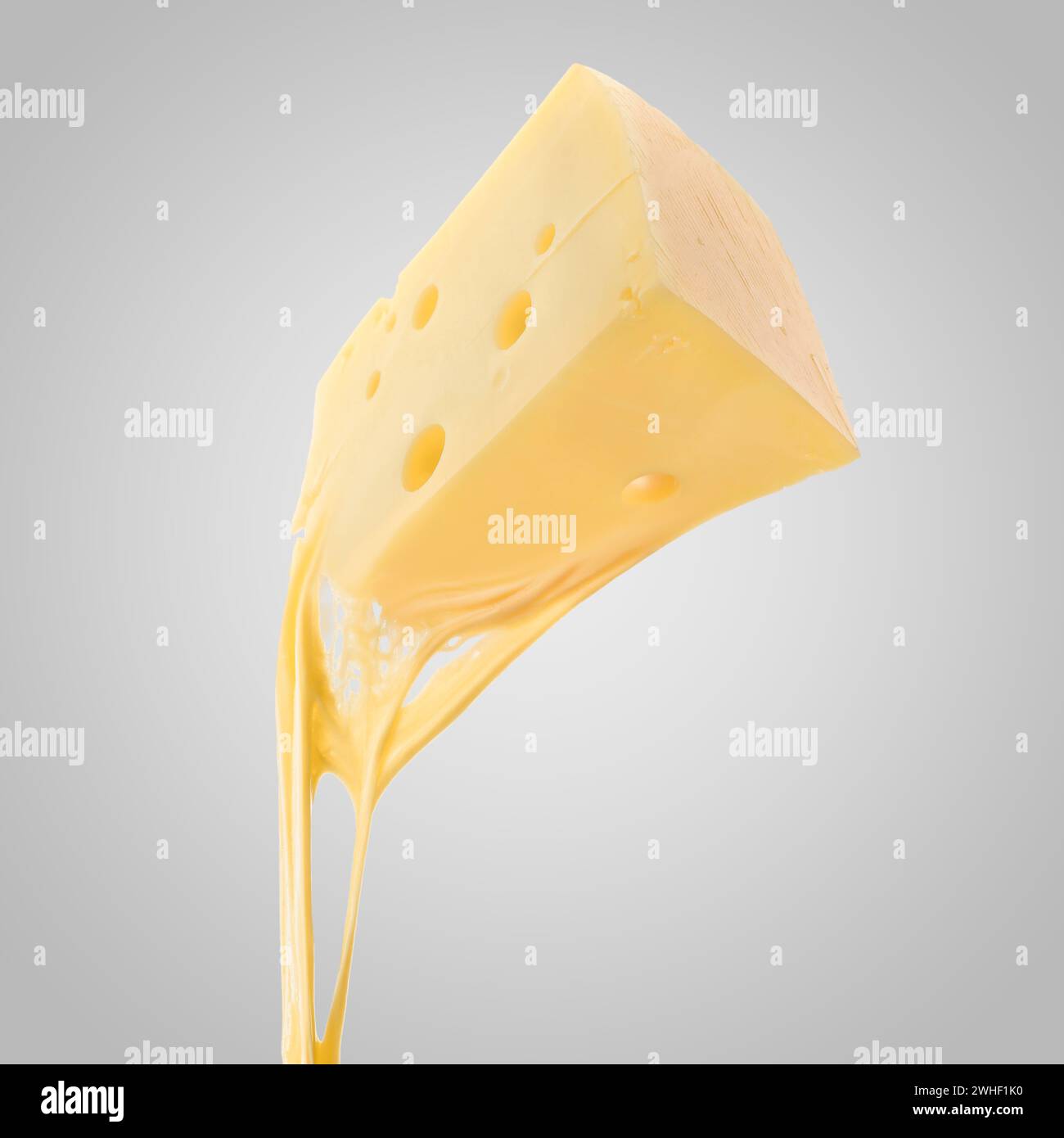 Tasty cheese stretching in air on grey background Stock Photo - Alamy