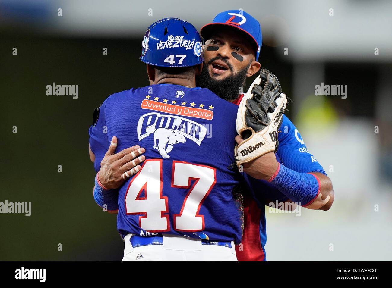 Dominican Republic's Emilio Bonifacio, right, embraces Venezuela's ...