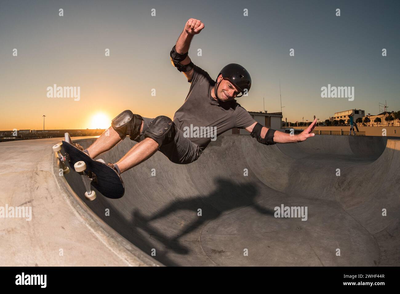 Skateboarder in a concrete pool Stock Photo - Alamy
