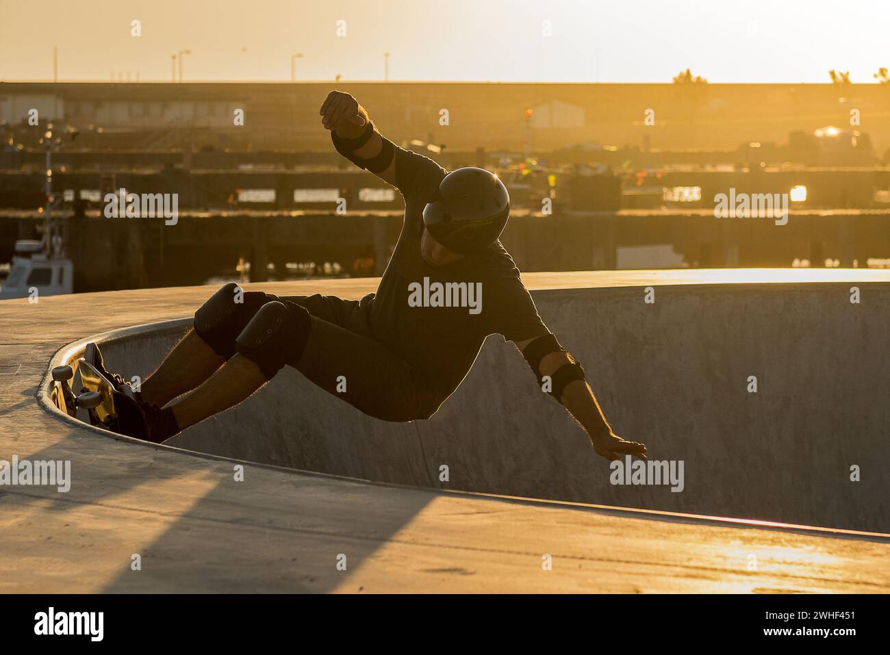 Skateboarder in a concrete pool Stock Photo - Alamy