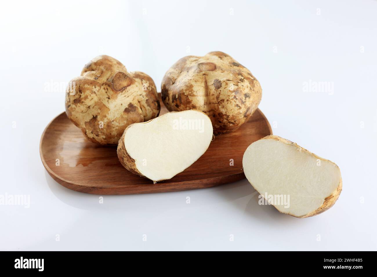 Jicama or Bengkuang on Wooden Plate, White Background Stock Photo - Alamy
