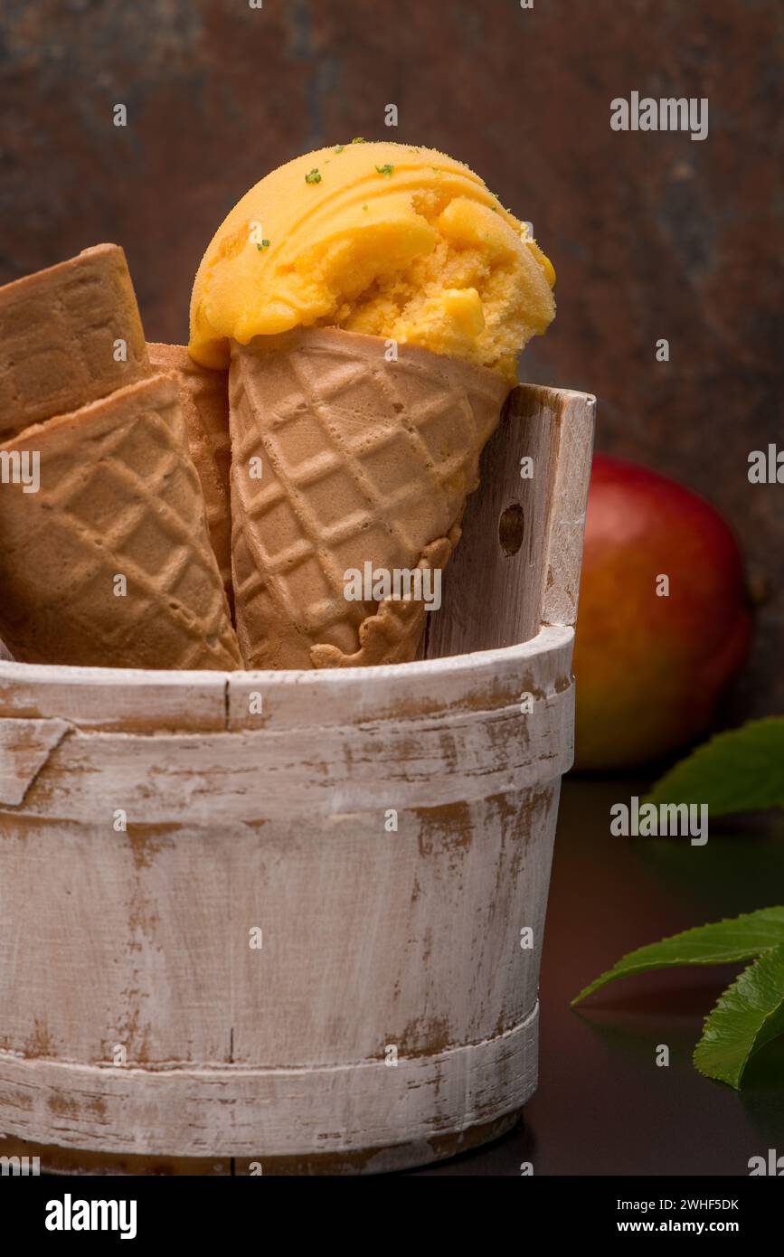 Homemade mango ice cream in waffle cone Stock Photo - Alamy