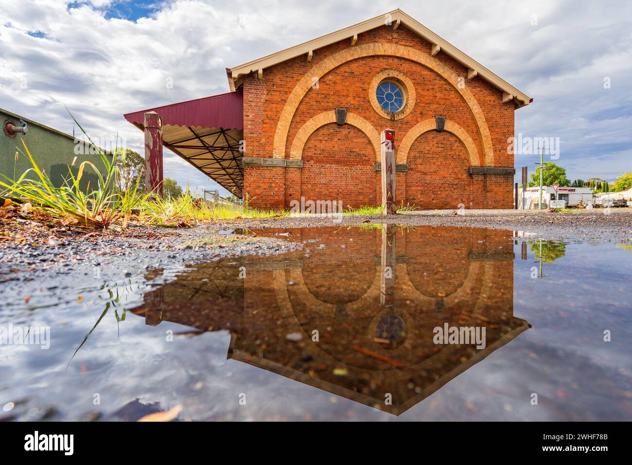 Low angled view of a railway goods shed with decorative brickwork ...