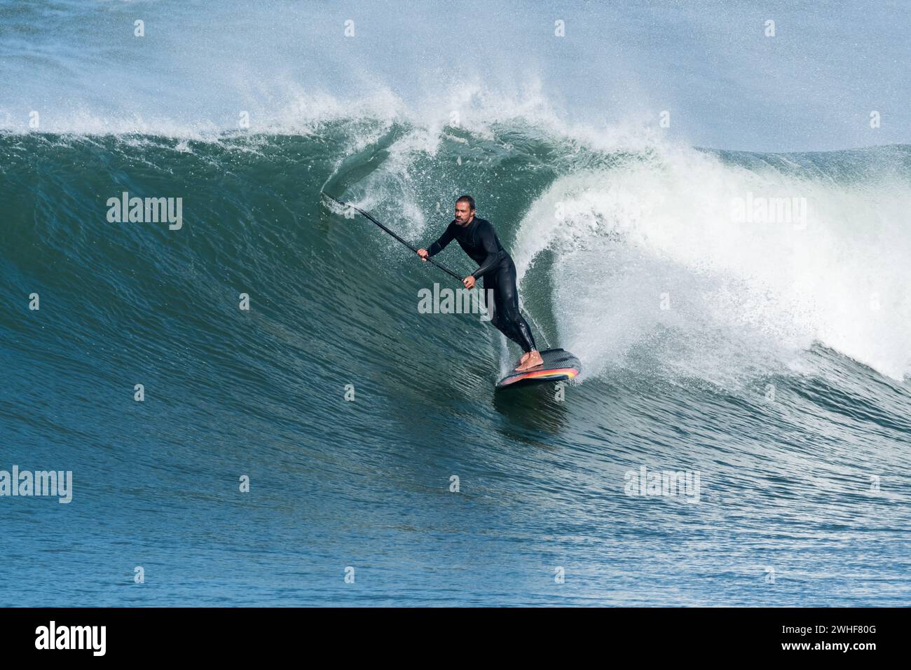 Stand up paddle surfer Stock Photo - Alamy