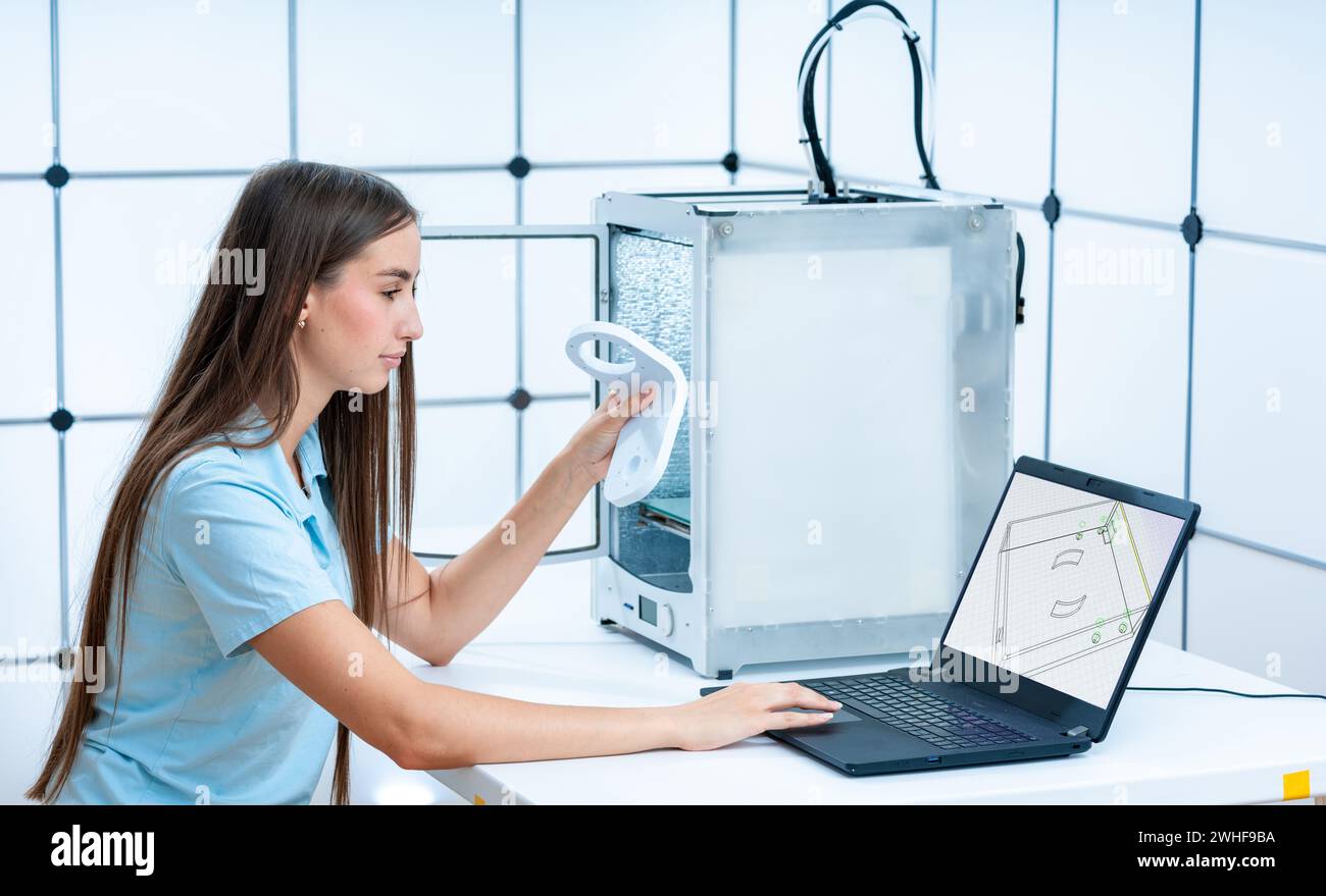 Scientist examining 3D print Stock Photo - Alamy