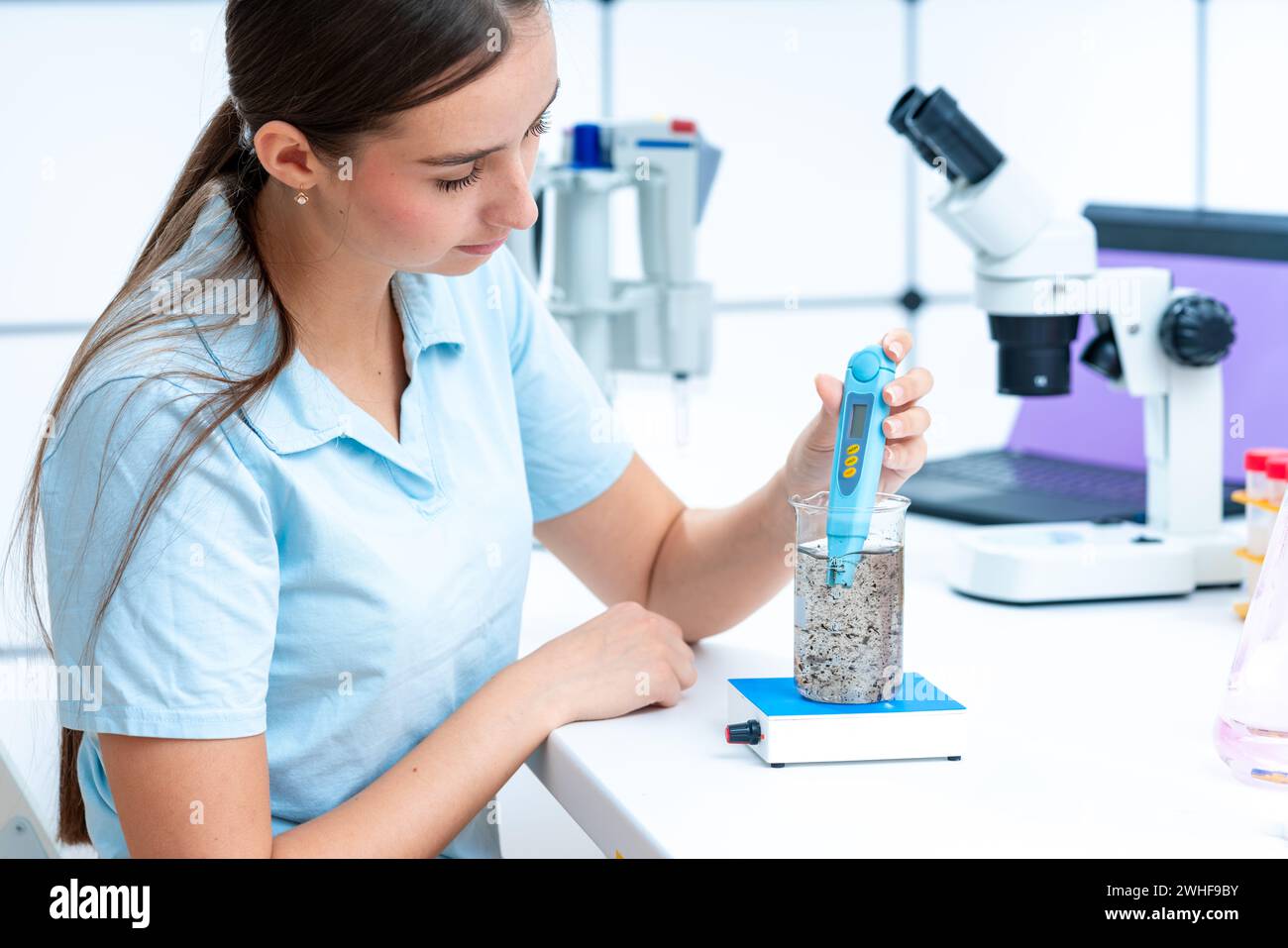 Scientist analysing liquid sample Stock Photo - Alamy