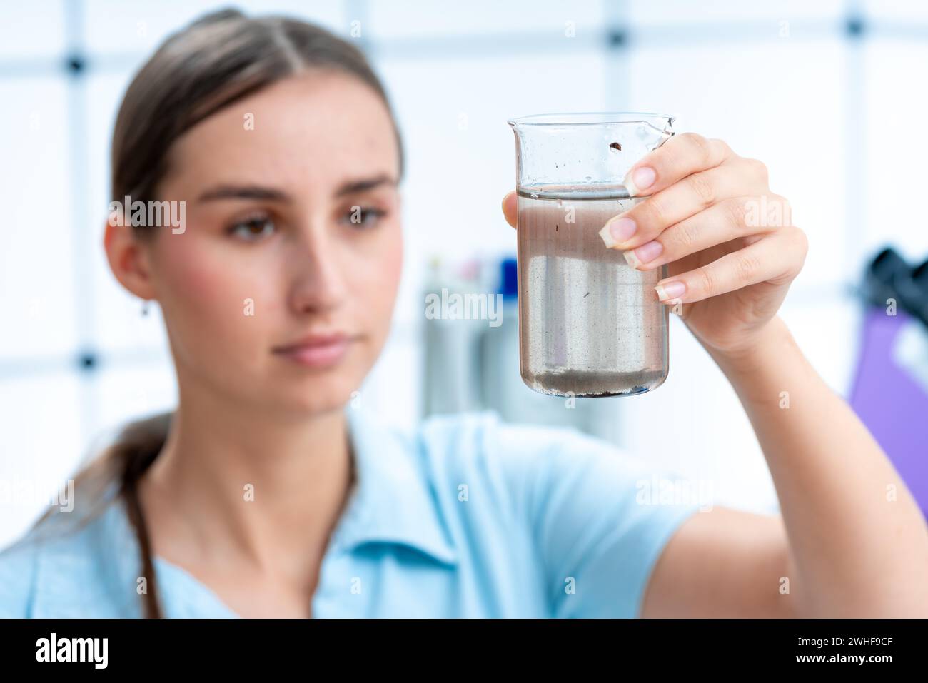 Scientist analysing liquid sample Stock Photo - Alamy
