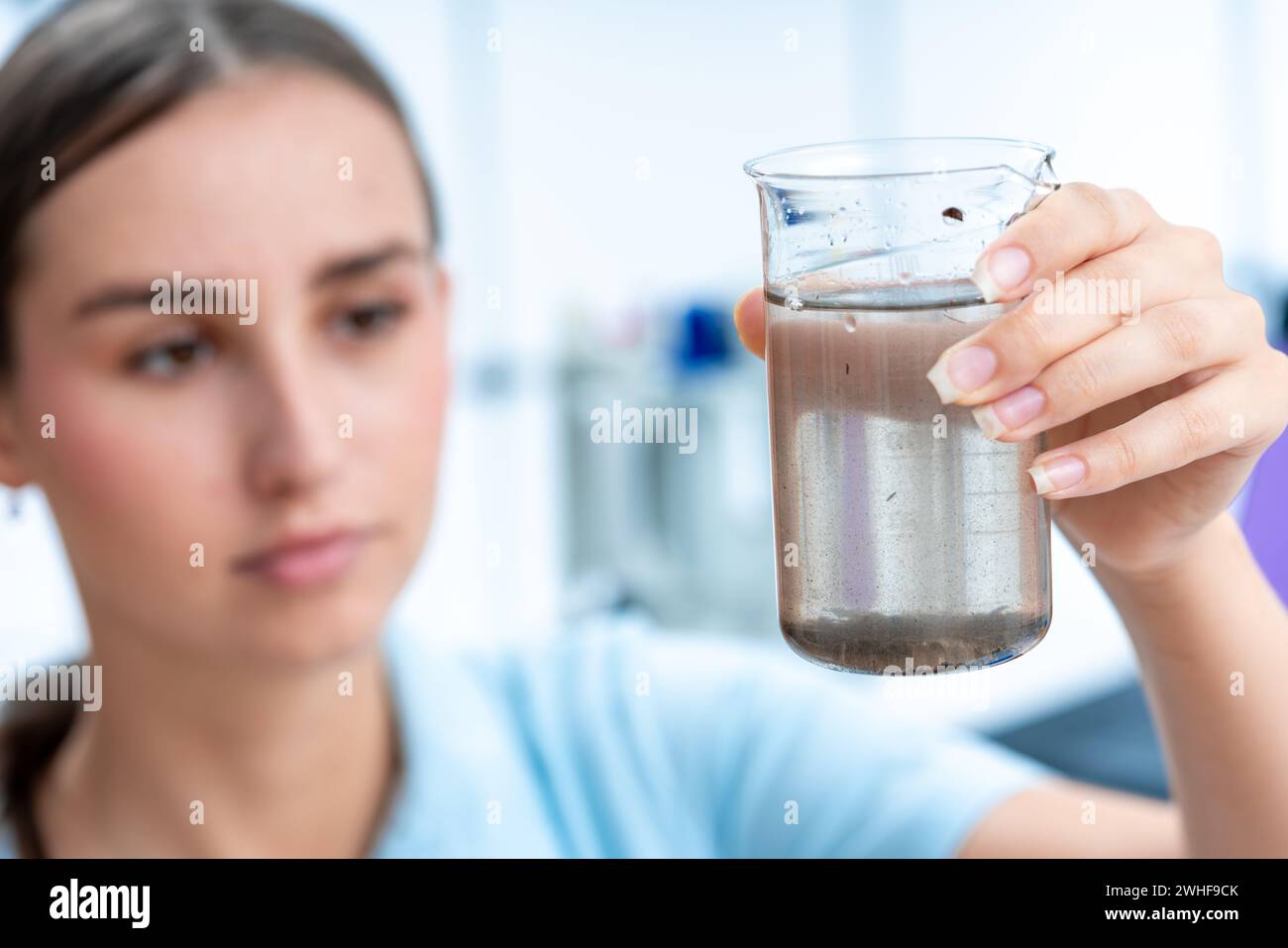 Scientist analysing liquid sample Stock Photo - Alamy