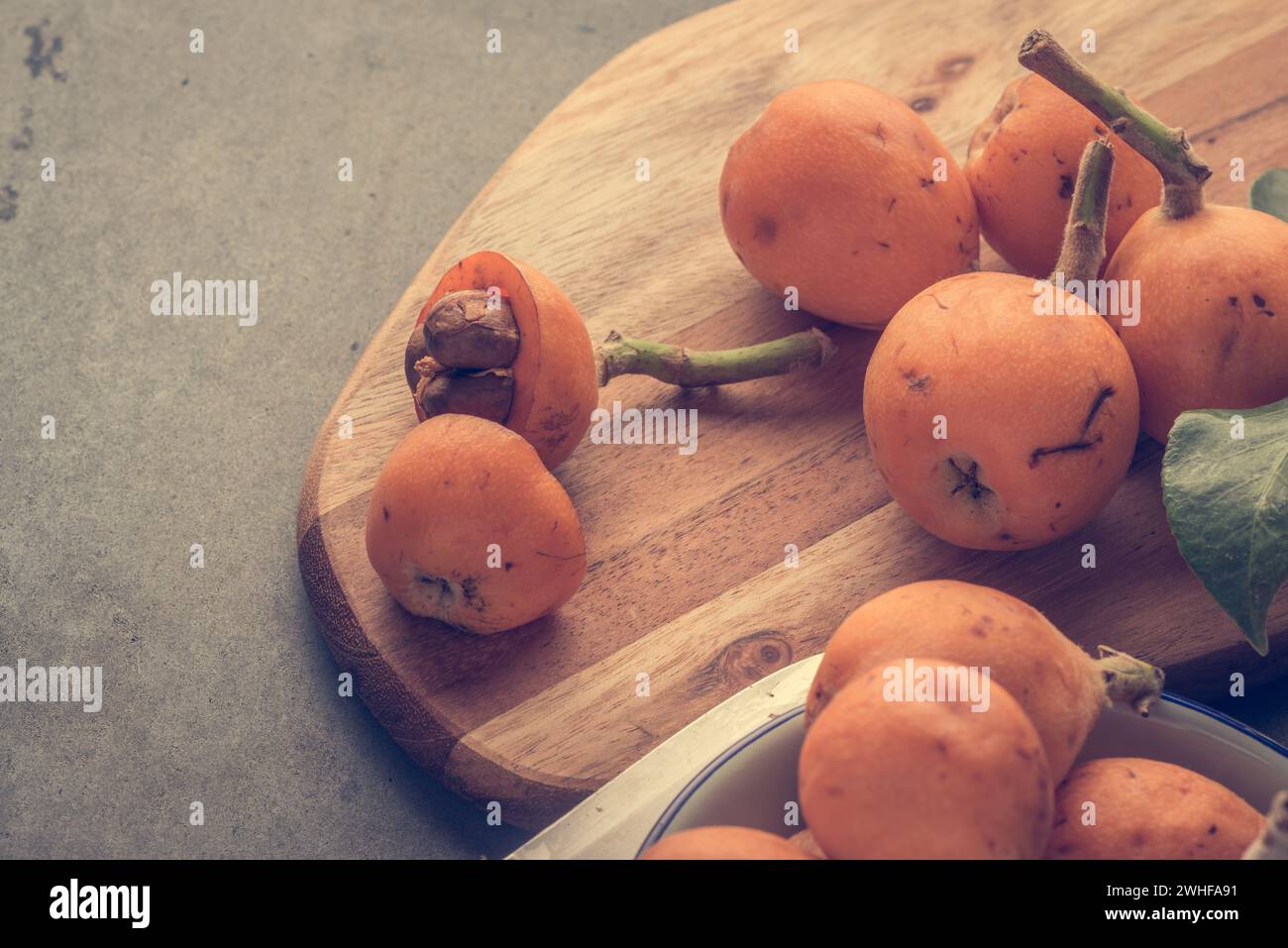 Loquats on kitchen counter Stock Photo - Alamy
