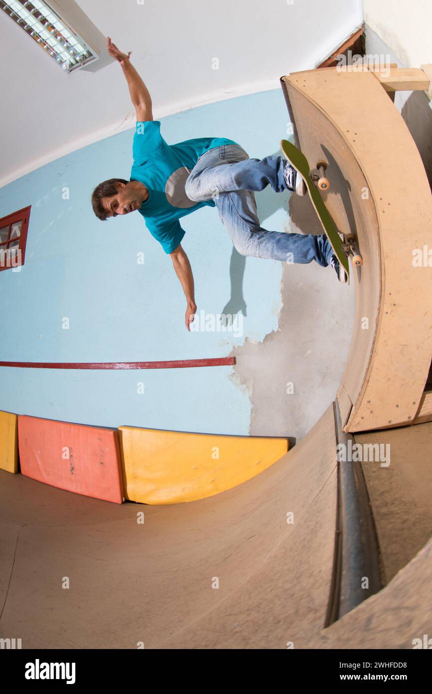 Skateboarder performing a backside turn Stock Photo - Alamy