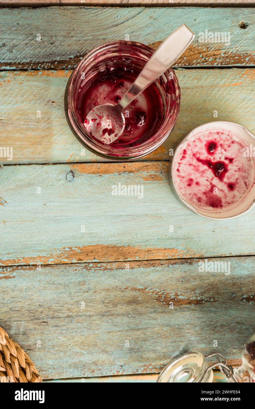 Glass jar with red fruits jam Stock Photo - Alamy