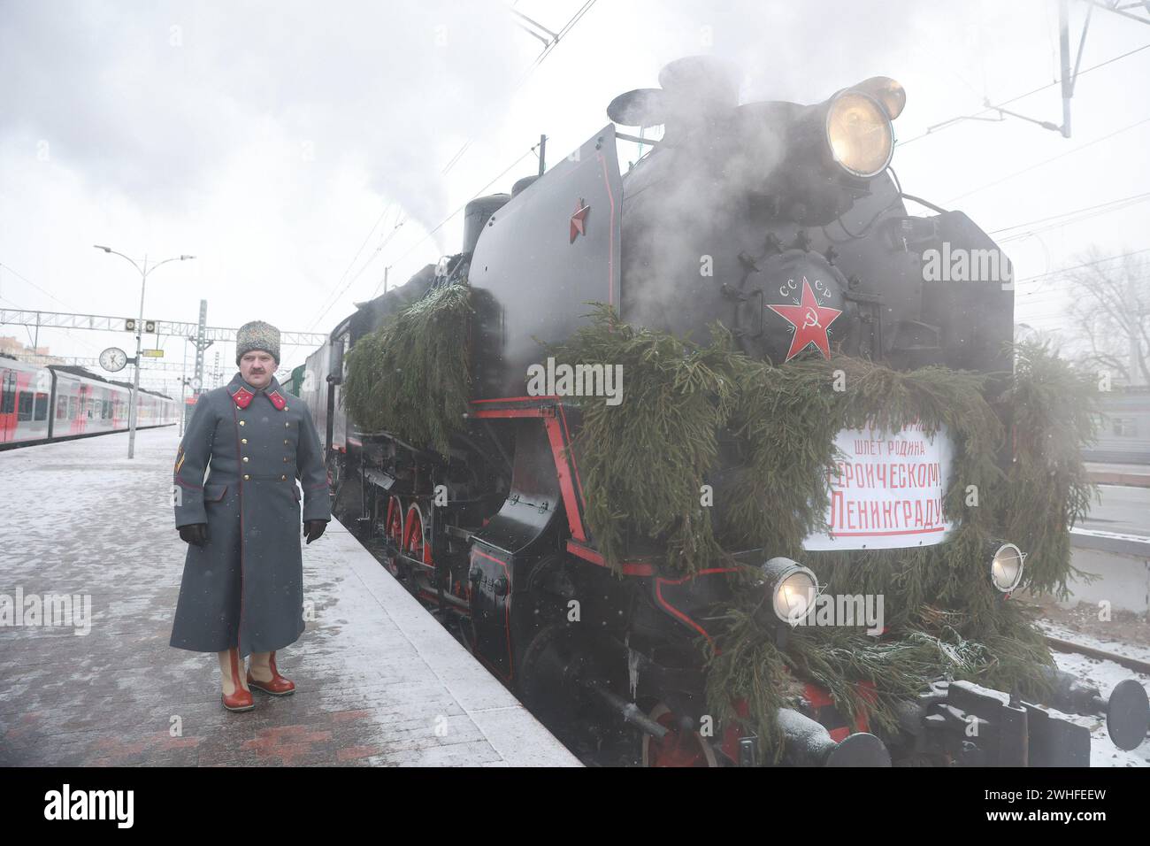 Saint Petersburg, Russia. 07th Feb, 2024. A Lo?omotive and a reenactor ...