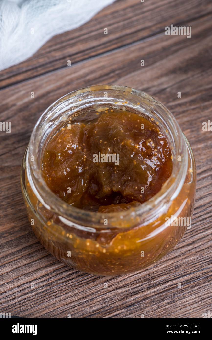 Glass jar full of fig jam Stock Photo - Alamy
