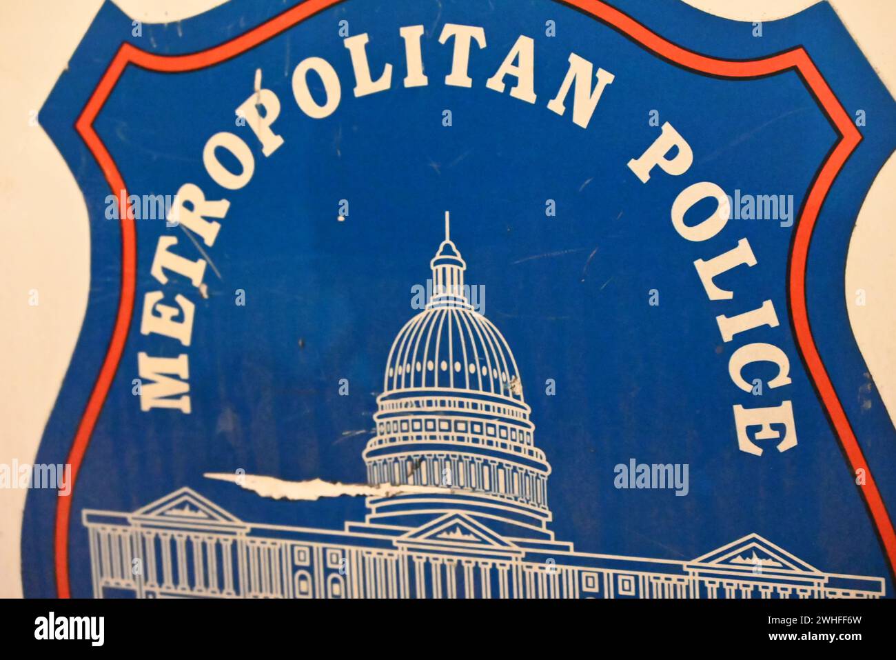 Metropolitan Police Department logo on a police vehicle at the crime scene. Police shoot suspect ...