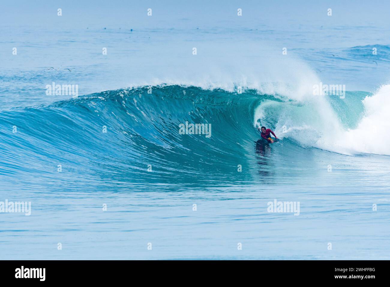 Bodyboarder surfing ocean wave Stock Photo - Alamy