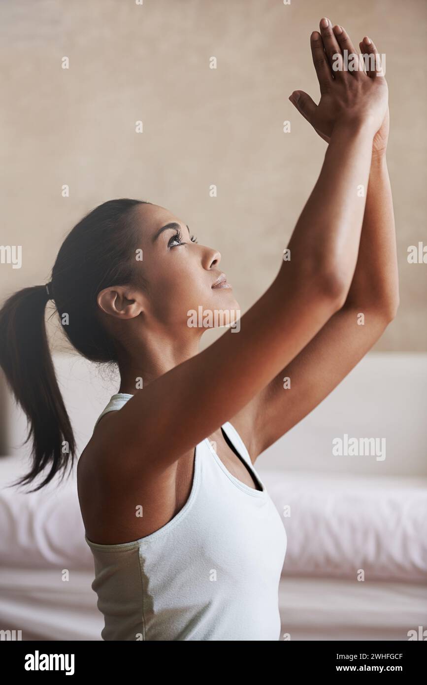 Yoga, wellness and woman in home stretching for training, exercise and ...