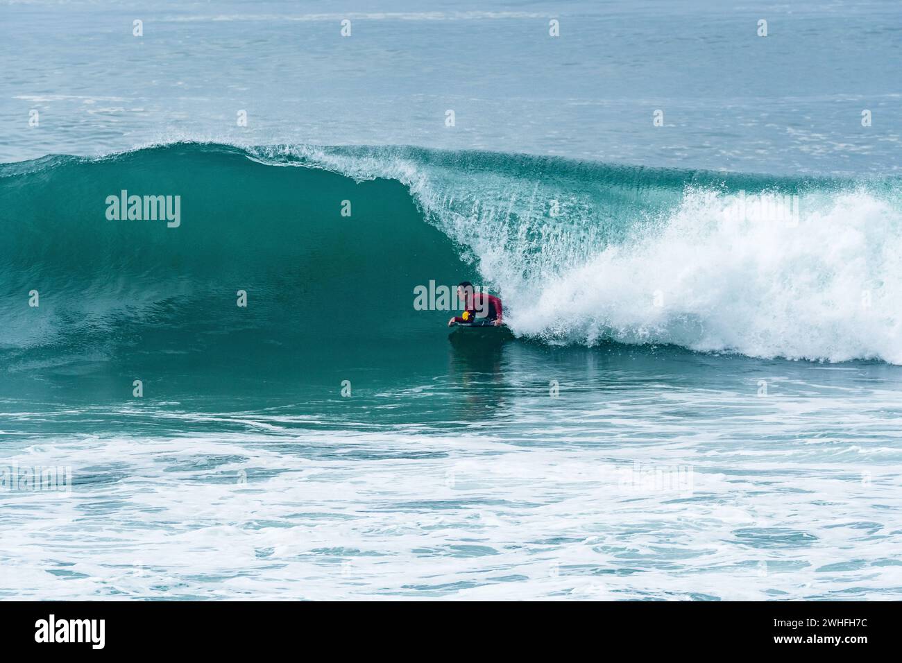 Bodyboarder surfing ocean wave Stock Photo - Alamy