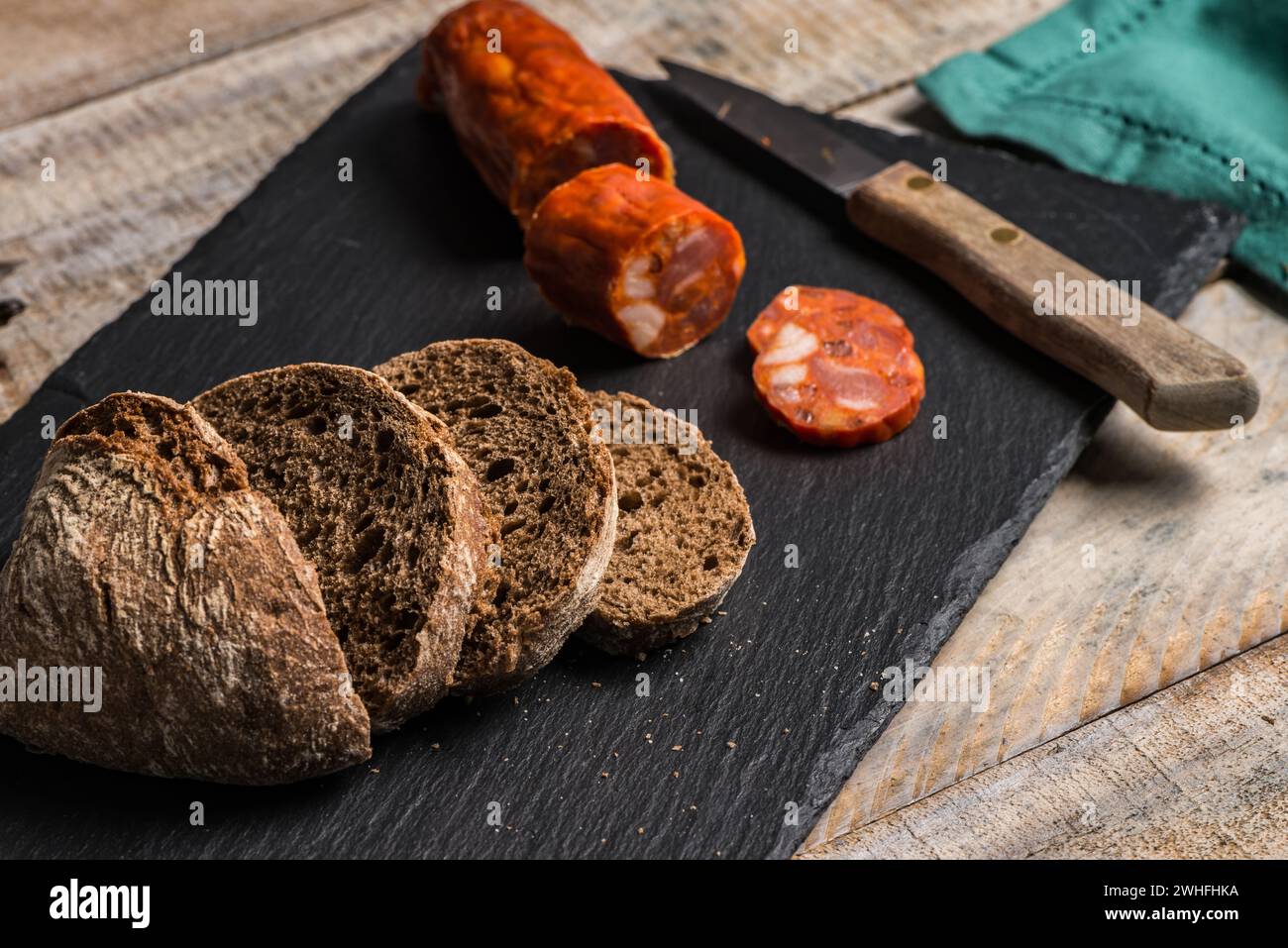 Malt loaf bread and chorizo slices Stock Photo - Alamy