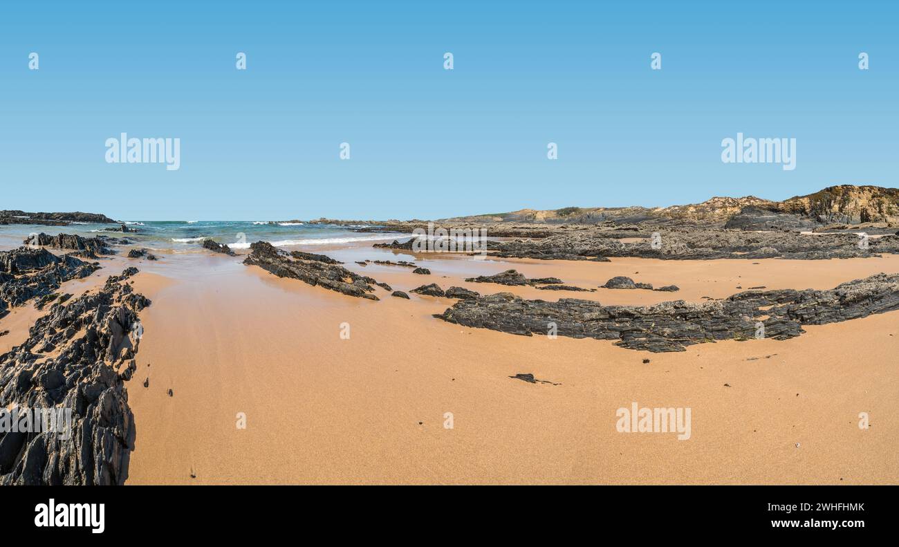 Beach with rocks in Almograve Stock Photo - Alamy