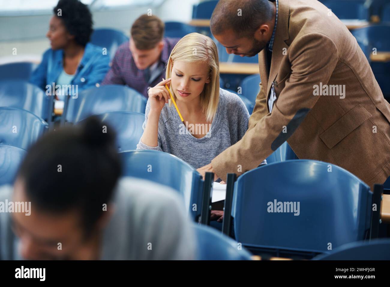 University, helping and professor with student in classroom studying ...
