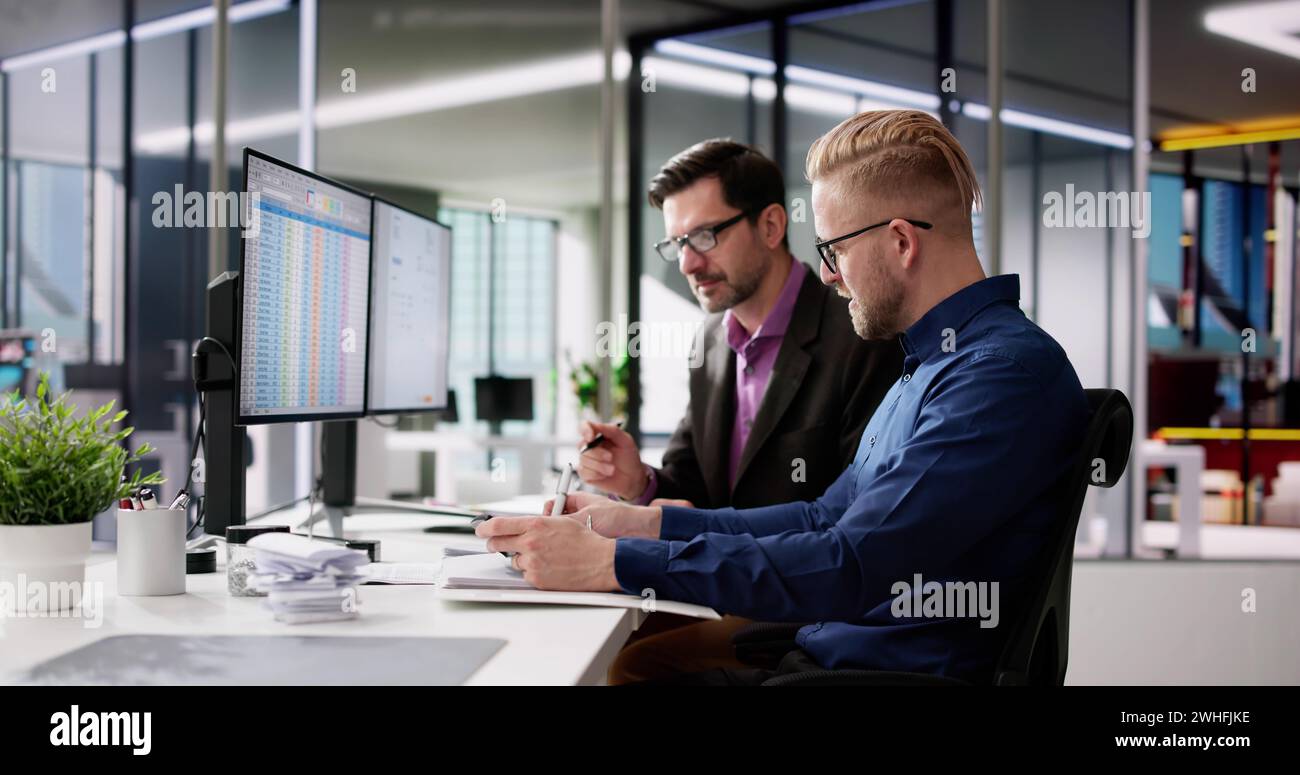 Using Corporate Invoice Spreadsheet On Computer Monitors Stock Photo ...