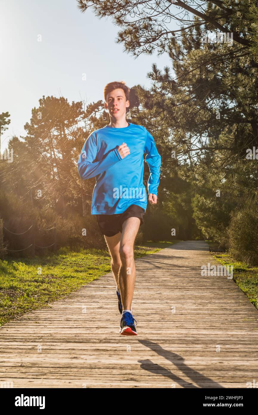 Young man running hi-res stock photography and images - Alamy