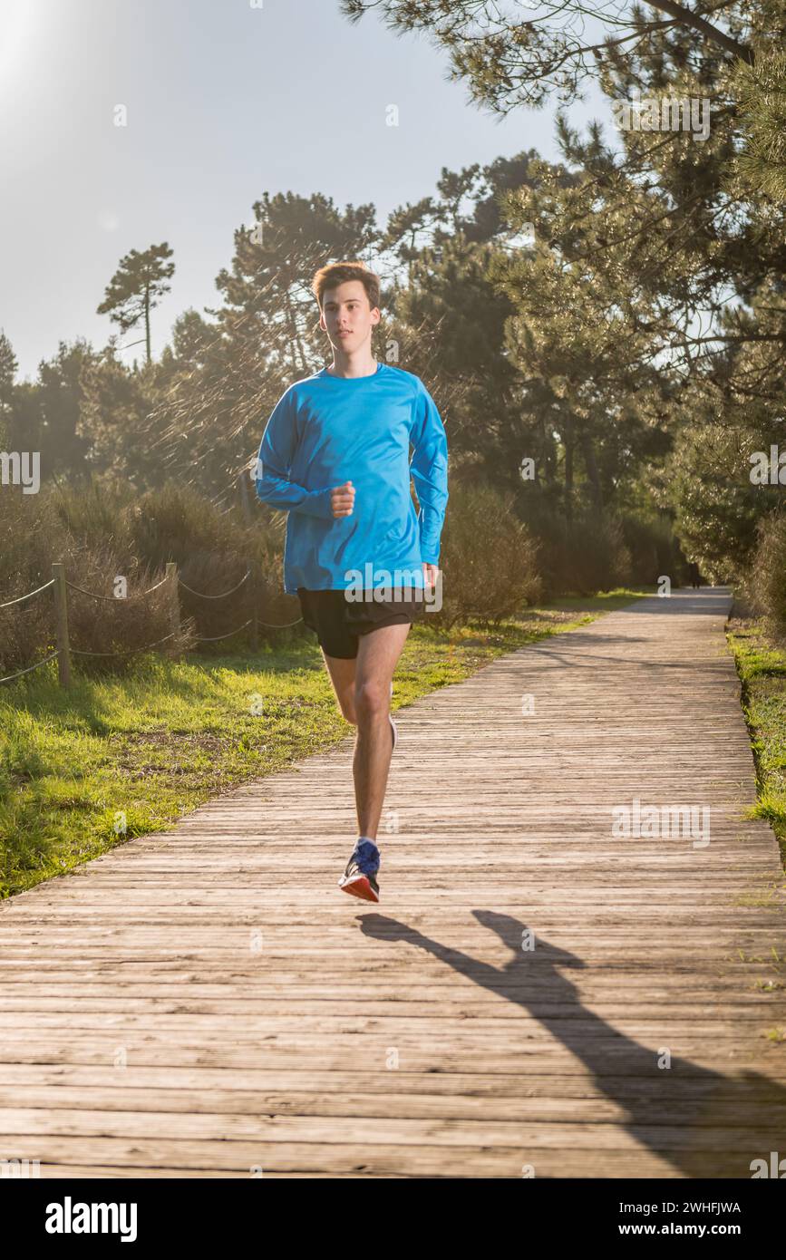 Young man jogging at sunrise hi-res stock photography and images - Alamy