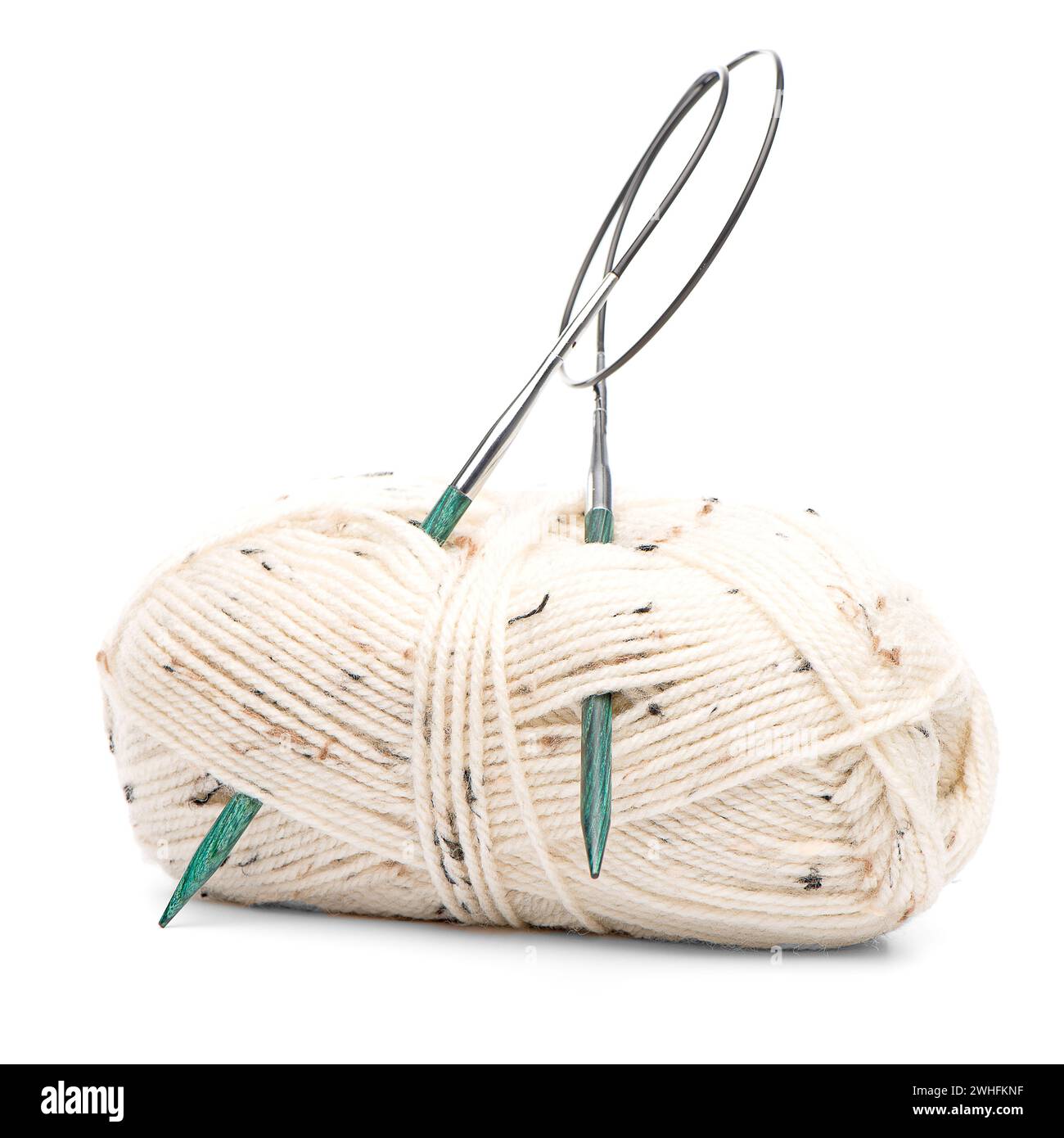 Beige knitting wool with needles Stock Photo - Alamy