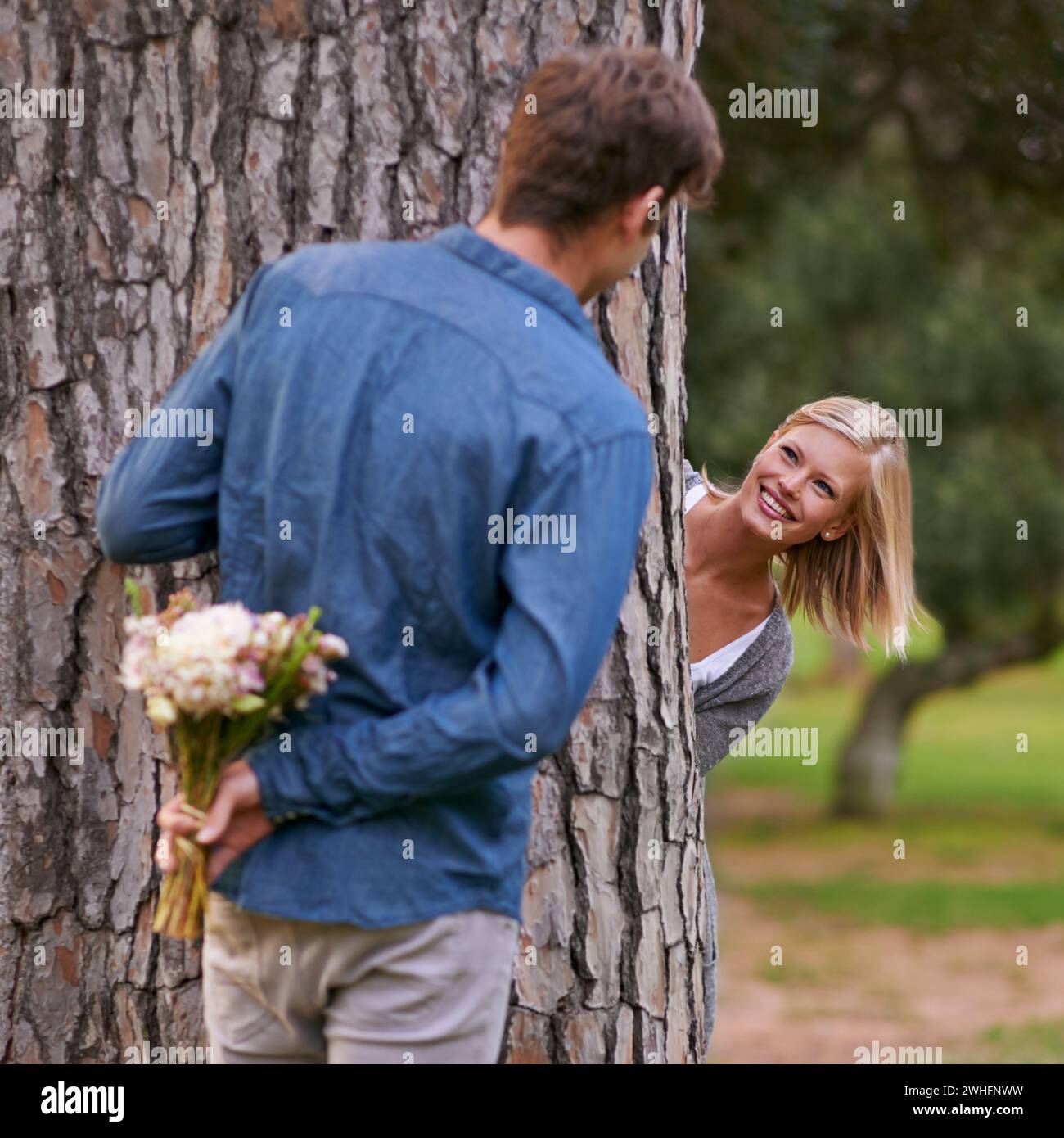 Couple, park and love for valentines day with flower in romance ...