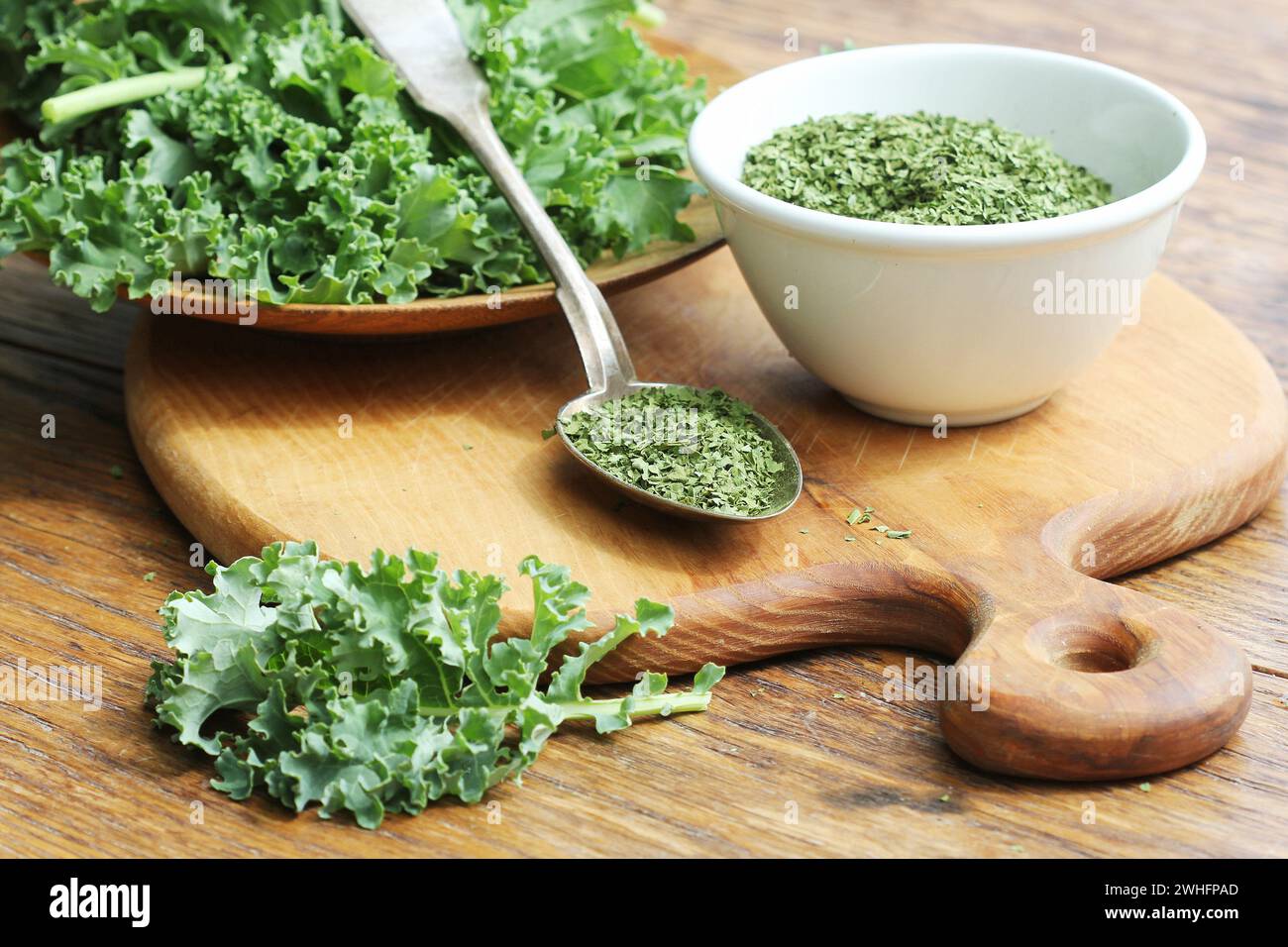 Chopped dry kale leaves on rustic background Stock Photo - Alamy