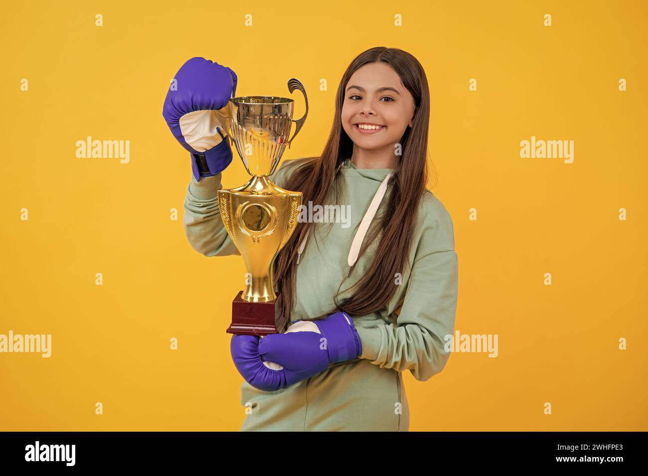 teen girl hold champion cup. boxing winner in sport sompetition. sport ...