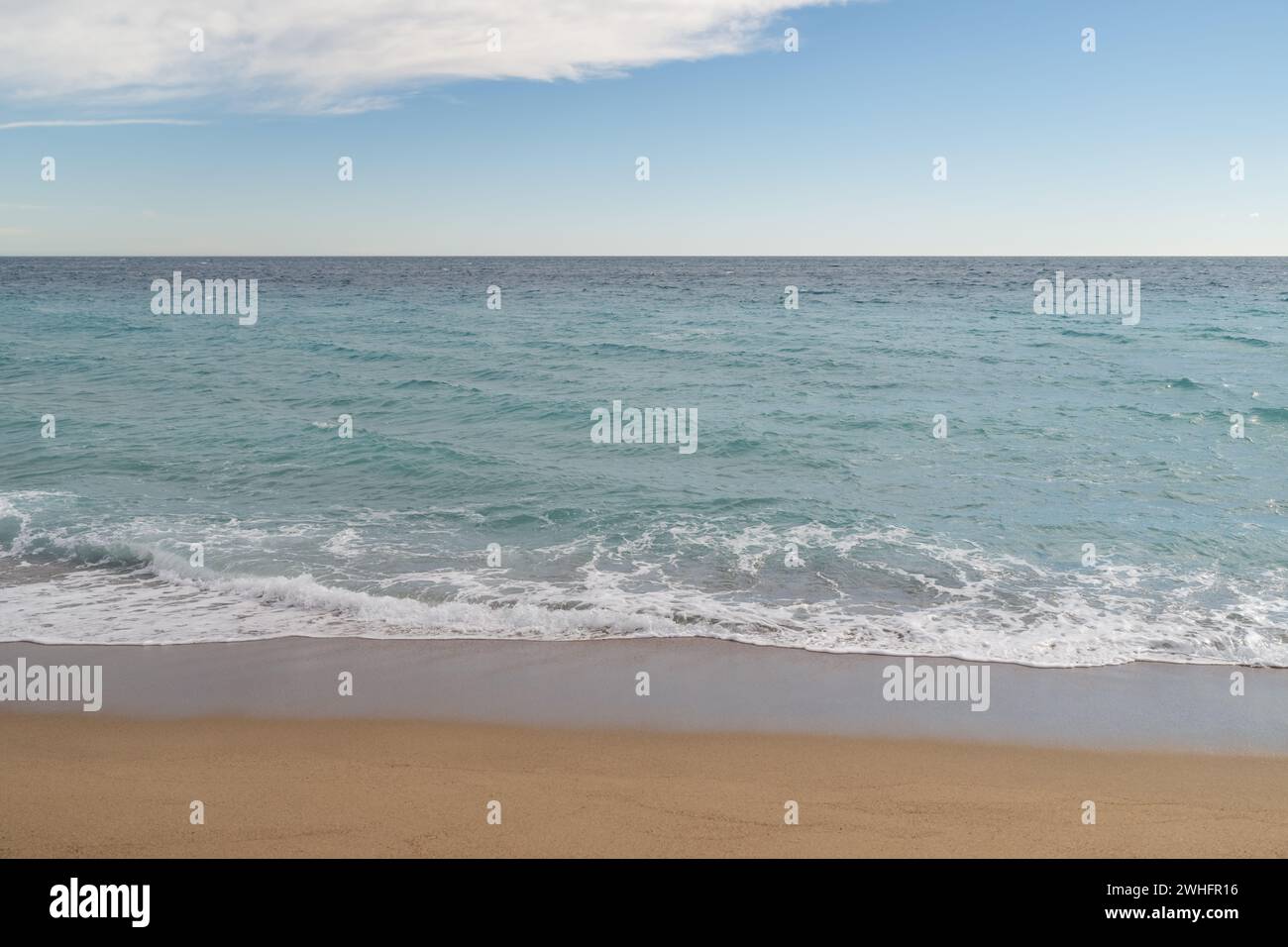 Empty sand beach on Mediterranean sea with horizon line vacation ...