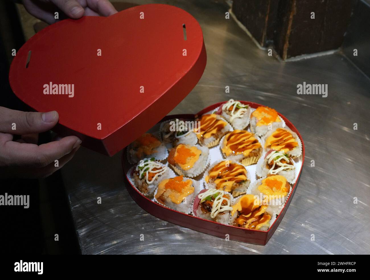 St. Louis, United States. 13th Feb, 2024. Chef Ernesto Alvarado puts ...