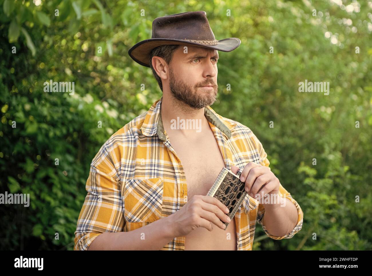 masculine cowboy with flask. masculine cowboy with flask outdoor ...