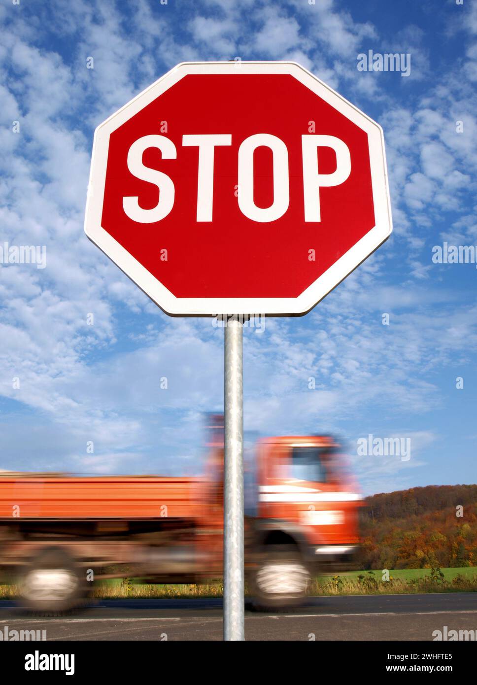 Stop sign with truck Stock Photo - Alamy