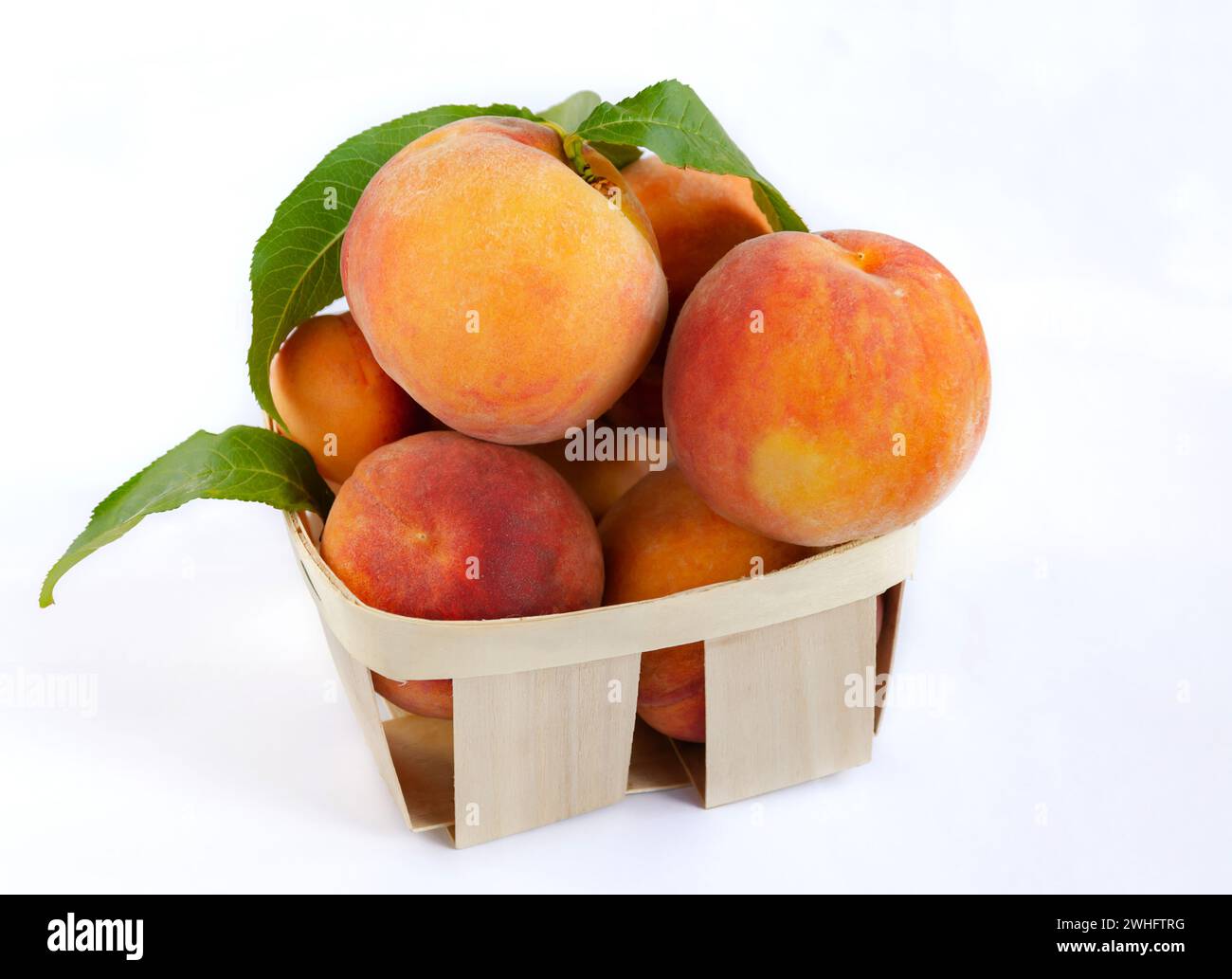 Peaches fruits with red sides in a slide on a light background Stock ...