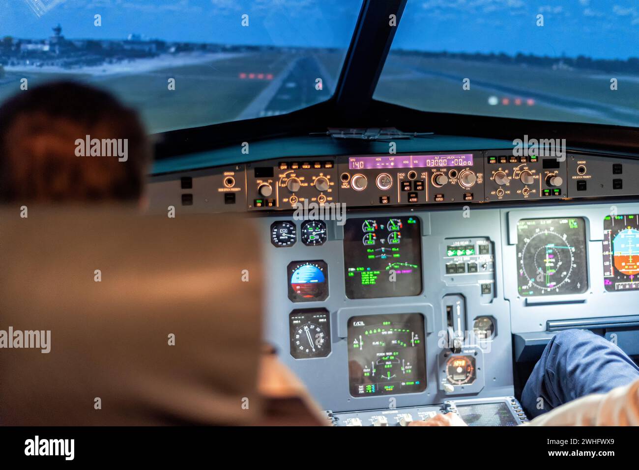 pilots in a cockpit in an airplane during flight Stock Photo - Alamy