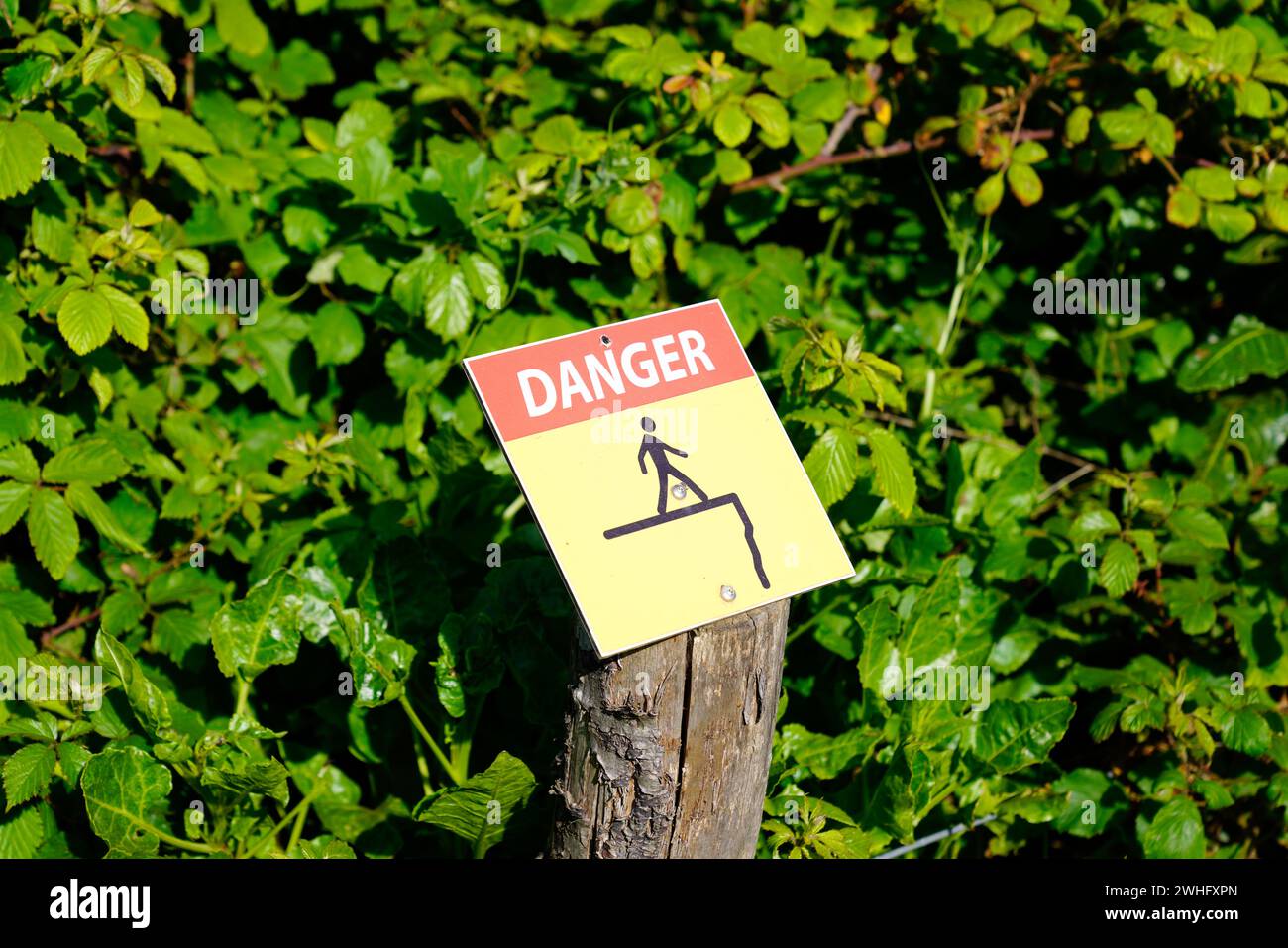 Red yellow warning sign danger text indicating the risk of falling when ...