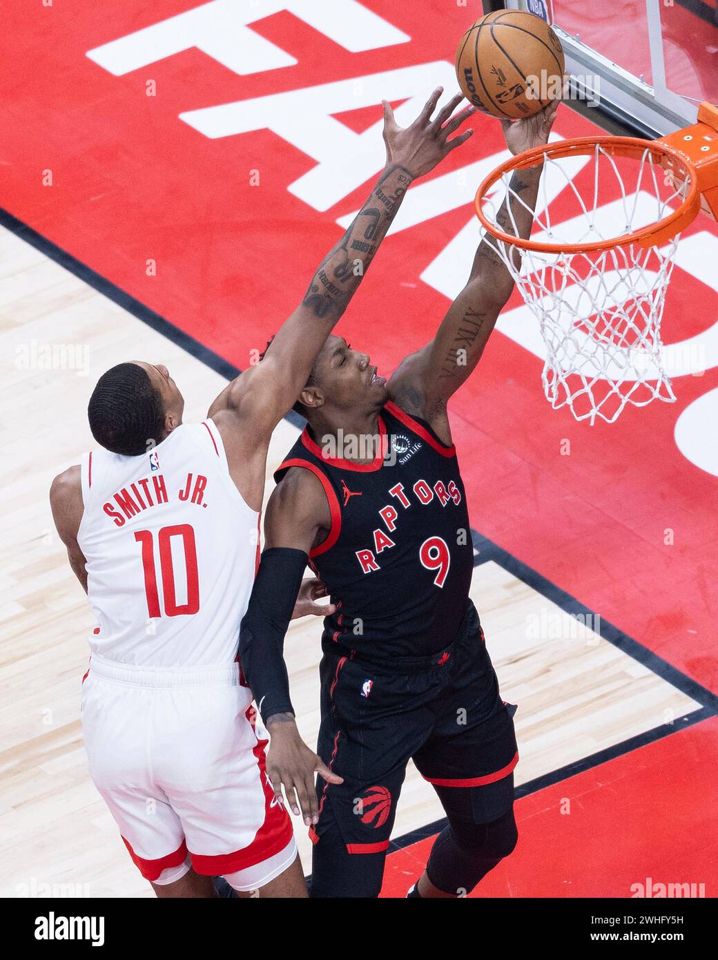 Toronto, Canada. 9th Feb, 2024. RJ Barrett (R) of Toronto Raptors goes for a lay-up during the ...