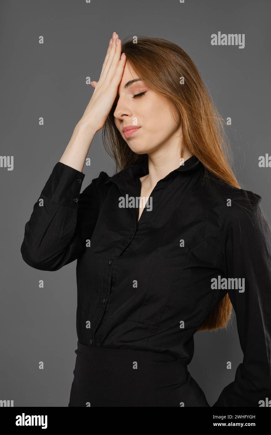 Upset Woman Makes Facepalm Gesture Slapping Herself On The Forehead