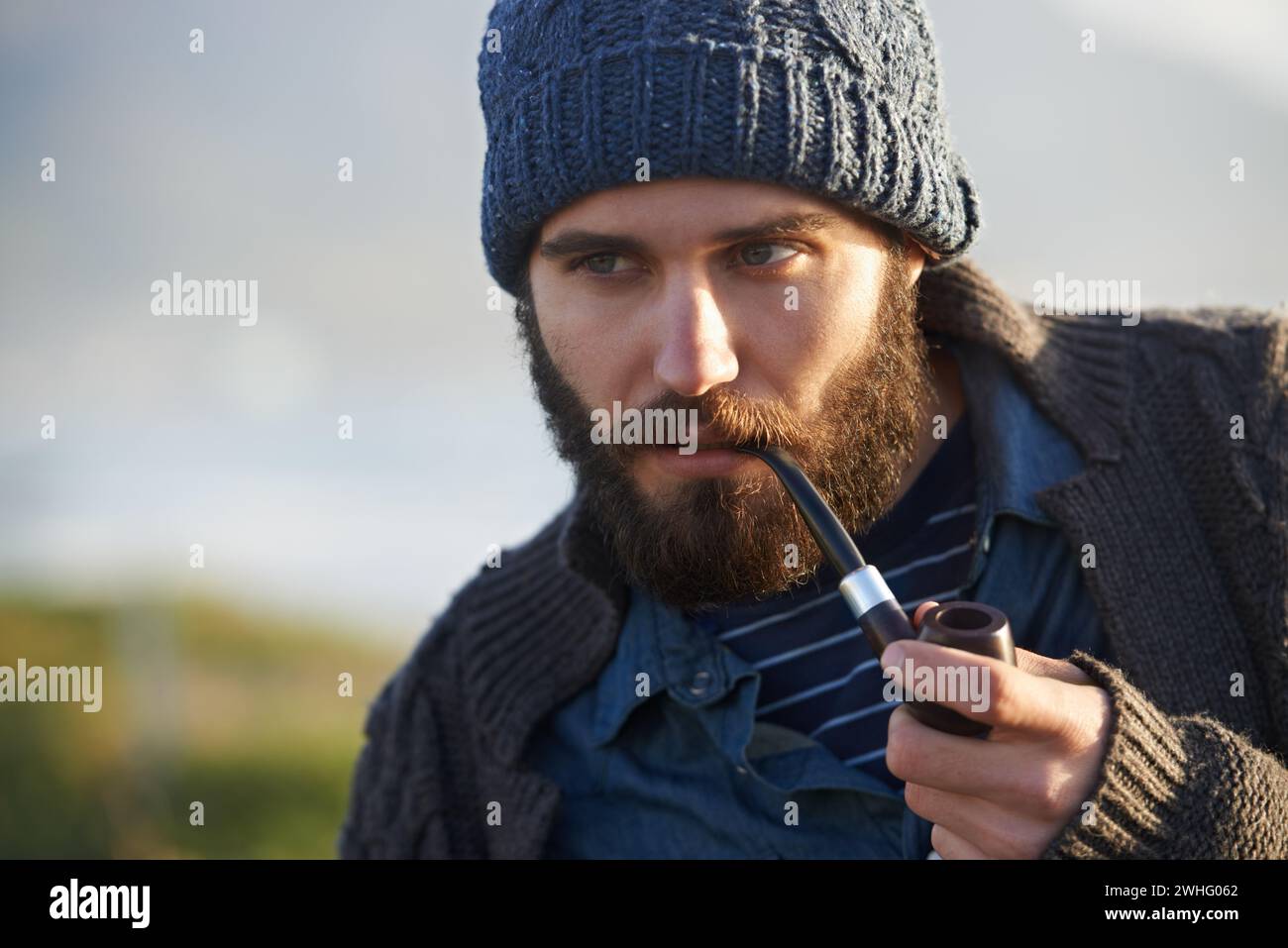 Holiday, man and smoker with pipe in nature, lighter and tobacco habit ...