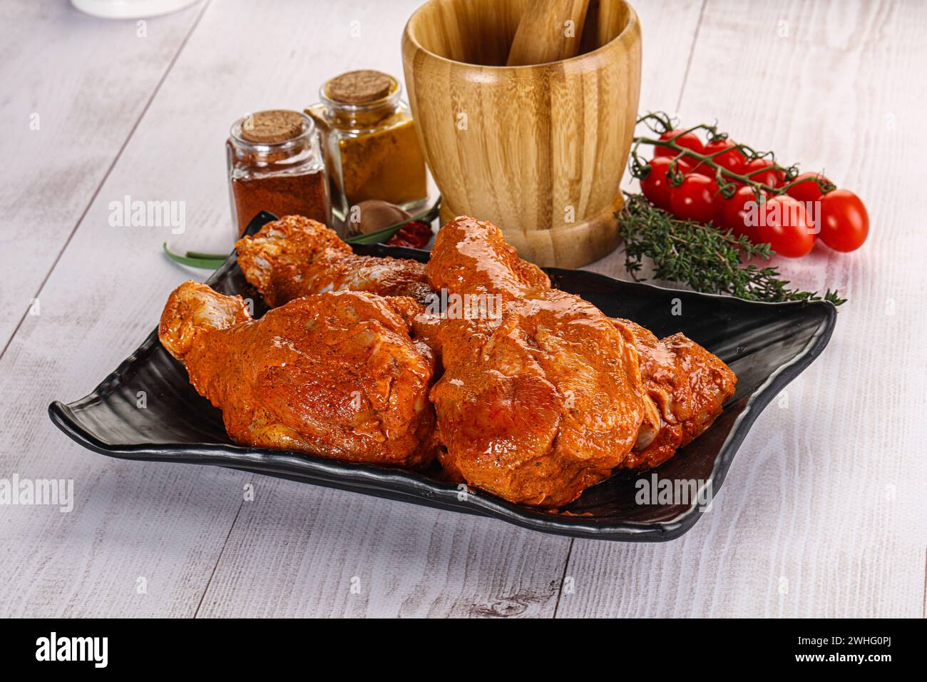Raw turkey shoulder wing in Indian tandoori marinade spices Stock Photo ...