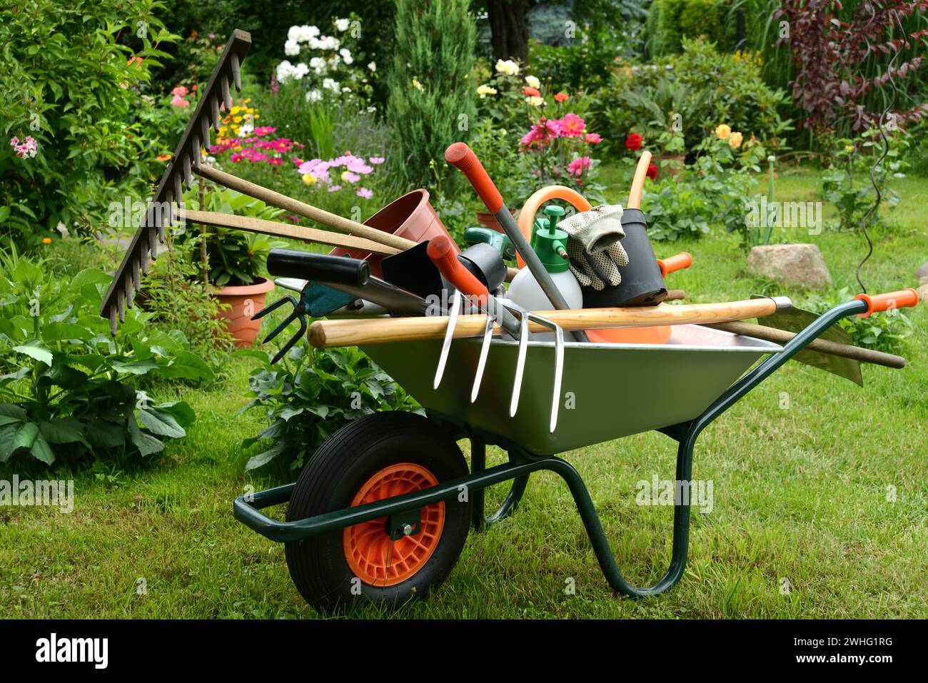 Garden tools on wheelbarrow Stock Photo - Alamy