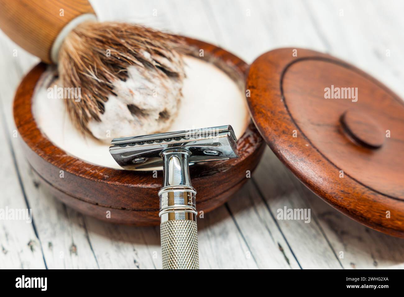 Traditional razor, razor brush and wooden bowl with razor soap Stock ...