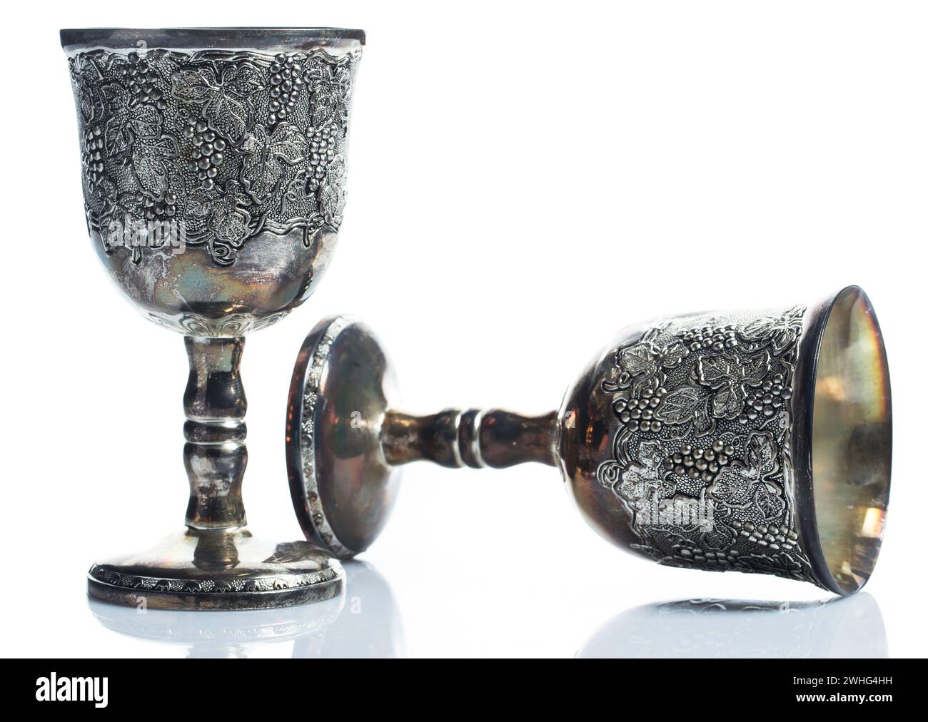 Old wine silver goblets against white background Stock Photo - Alamy