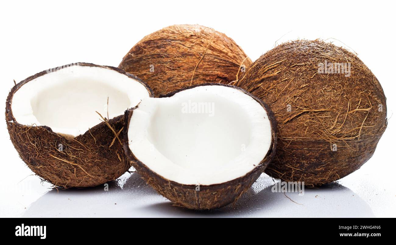 Fresh tropical fruits coconuts on white background Stock Photo - Alamy