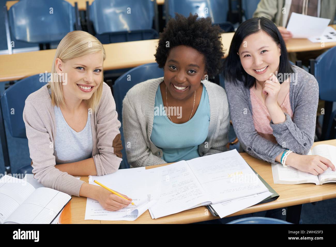 Paperwork, students or portrait of women in library for education ...